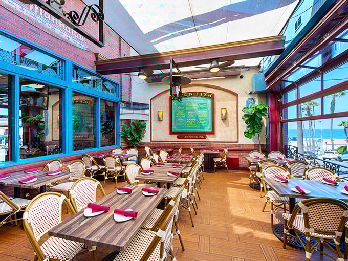 The covered patio combines the best of both worlds—fresh air dining with protection from the elements and a perfect view of the menu board.