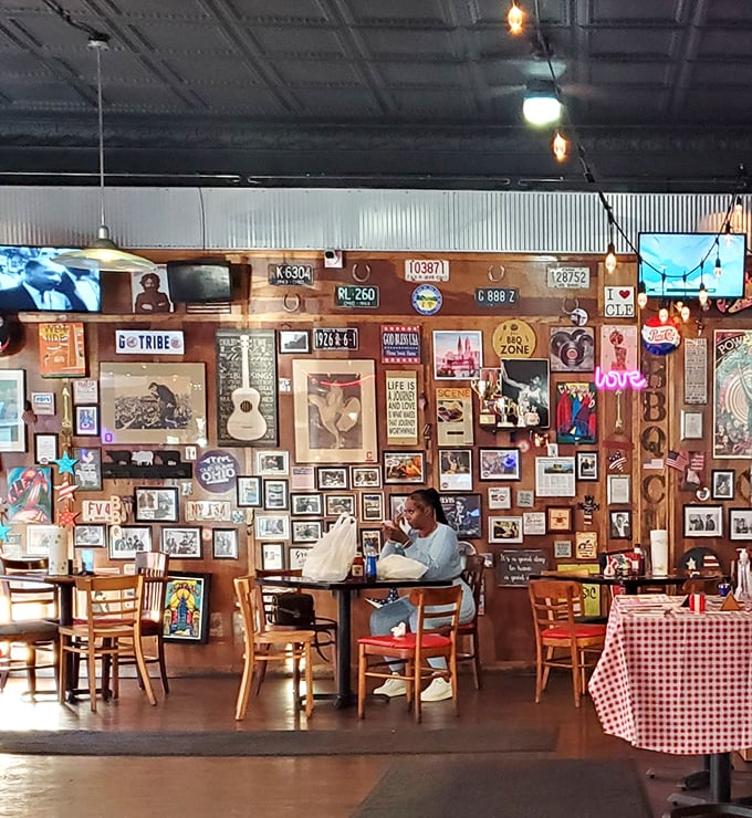 Every inch of wall space tells a story – from Elvis to local heroes. This diner knows she's sitting in a temple of smoke and flavor.