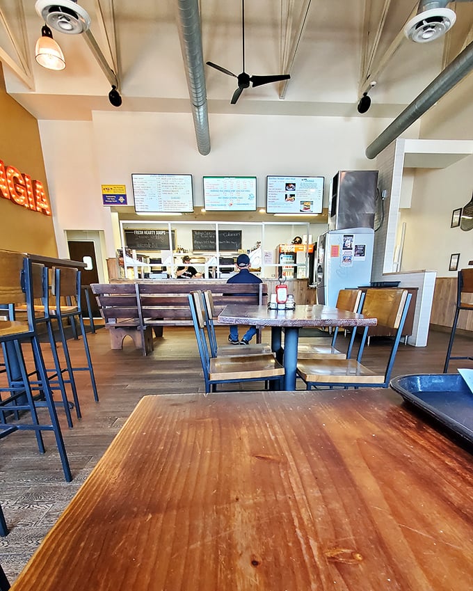Simple wooden tables and industrial touches create that perfect "come as you are" vibe—a judgment-free zone for serious eating.