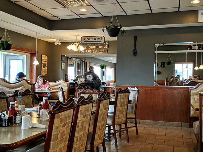 A dining room where "Eat here once, you are family" isn't just a cute sign on the wall—it's the unspoken promise delivered with every meal.