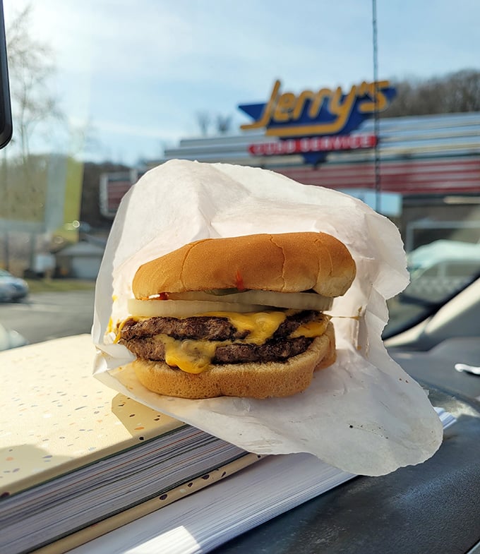 The double cheeseburger poses majestically against the Jerry's sign—like a food version of an album cover shot.