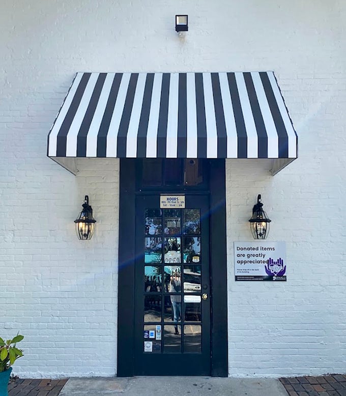 The entrance beckons with classic black-and-white awning drama. Like the doorway to Narnia, if Narnia were filled with other people's treasures.