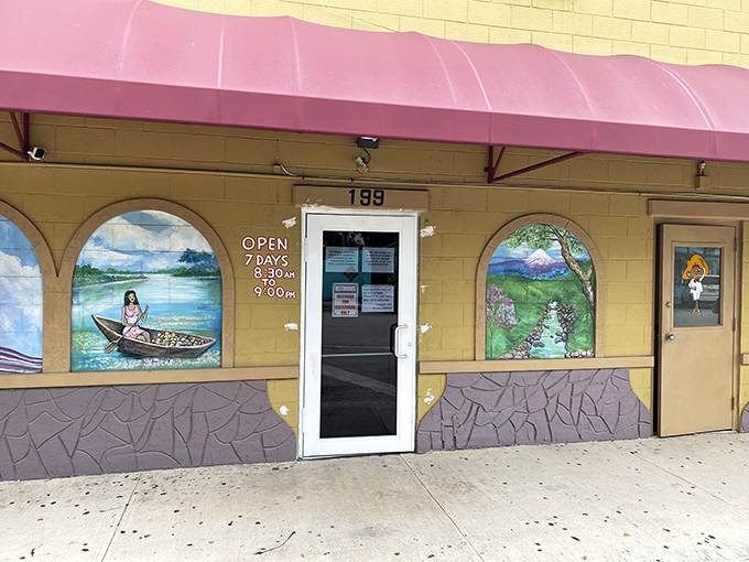 The entrance tells you everything you need to know – open seven days, hand-painted murals, and a door that's welcomed locals and travelers alike for years.