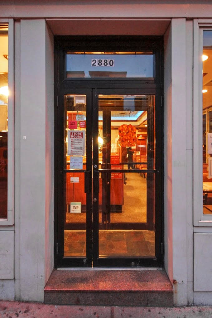 The entrance to Tom's isn't just a doorway—it's a portal between the frenetic energy of New York streets and the timeless comfort waiting inside.