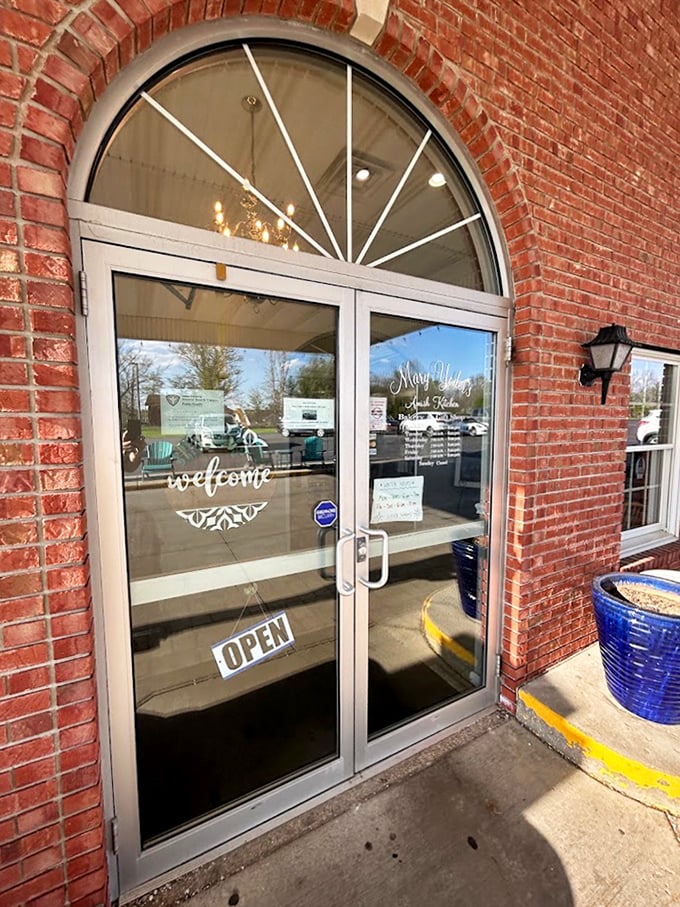 That arched doorway welcomes you inside, where the word "welcome" on the glass is wonderfully redundant but genuinely meant.