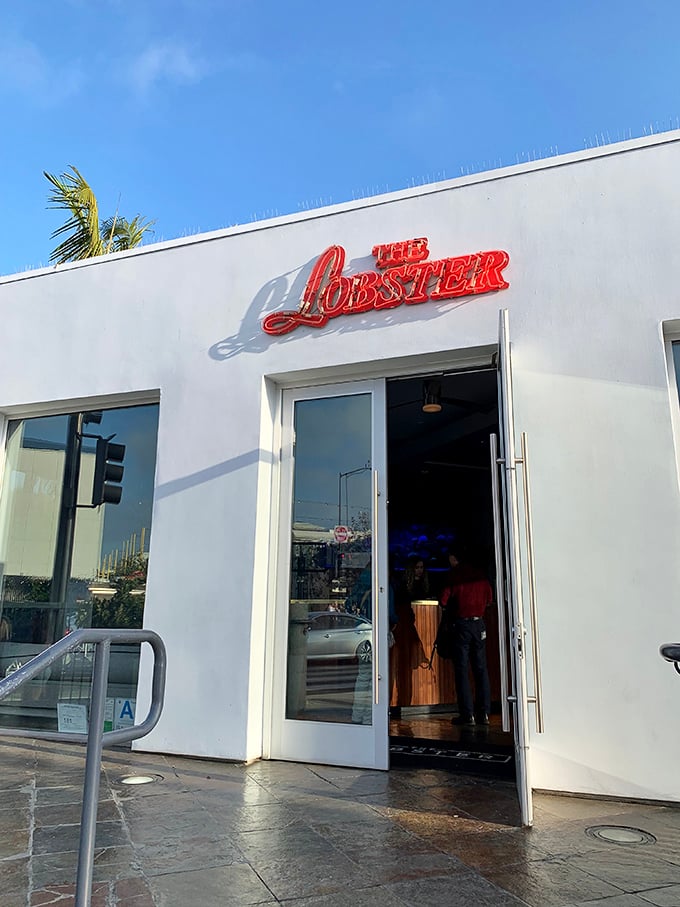 The entrance beckons with its simple neon sign – no flashy gimmicks needed when what awaits inside speaks so eloquently for itself.