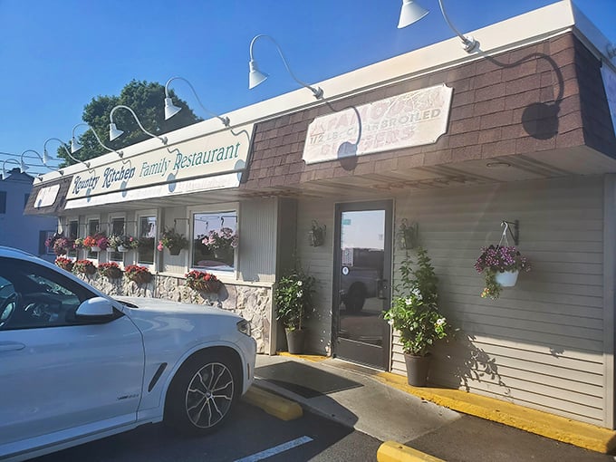 Flower baskets frame the entrance like nature's welcome committee. Your diet doesn't stand a chance against what waits inside.