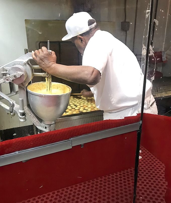 The donut-making process laid bare—a behind-the-scenes glimpse at the alchemy that transforms simple ingredients into morning glory.