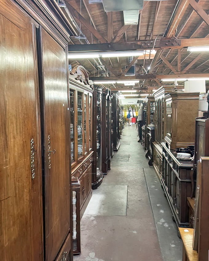 The furniture corridor feels like walking through a museum where everything's for sale. These aren't just cabinets—they're solid wood time capsules.