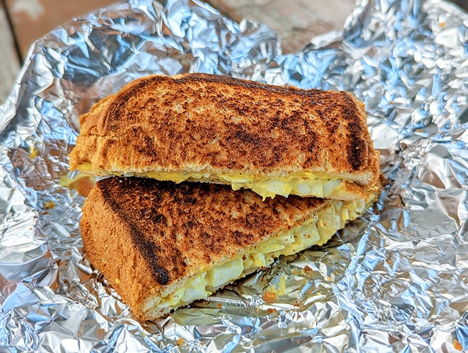 A grilled cheese sandwich that achieves the golden ratio of buttery crunch to melty interior—comfort food elevated to an art form.