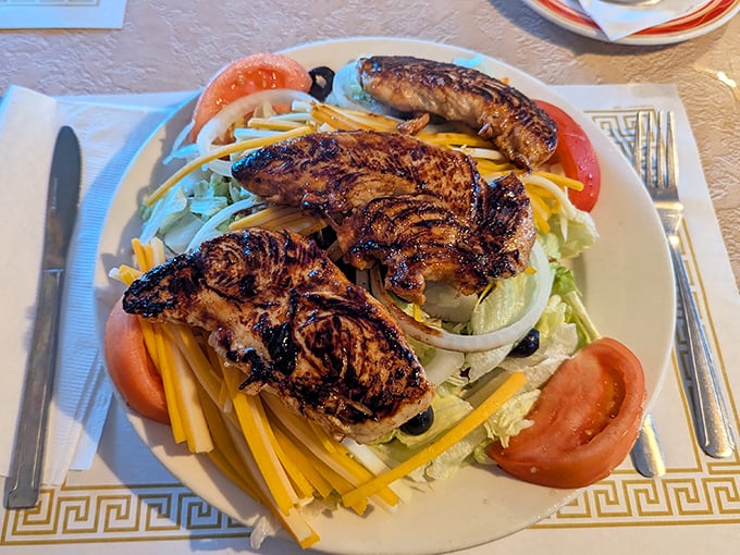 This grilled chicken salad isn't just healthy eating—it's a colorful celebration that proves Fred's does "light" options with the same dedication as their heartier fare.