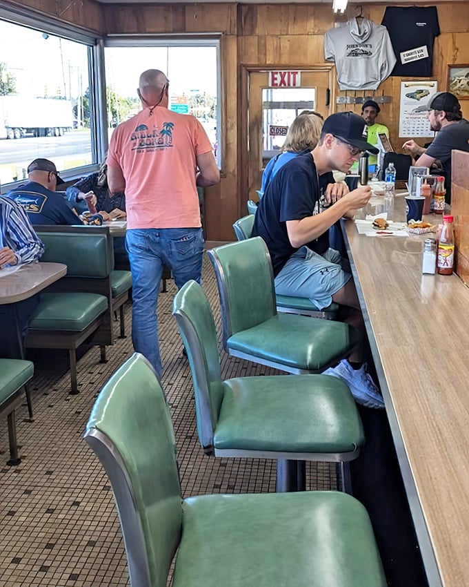 The lunch counter democracy—where doctors sit next to mechanics, and everyone gets the same exceptional burger. America at its finest.