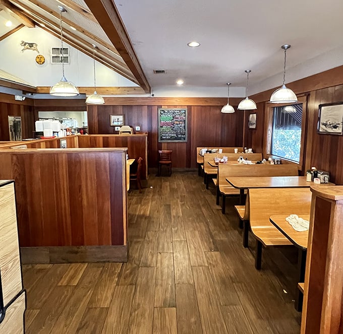 The dining room's warm wood tones and booth seating create that perfect "I'm going to need elastic waistband pants" atmosphere.