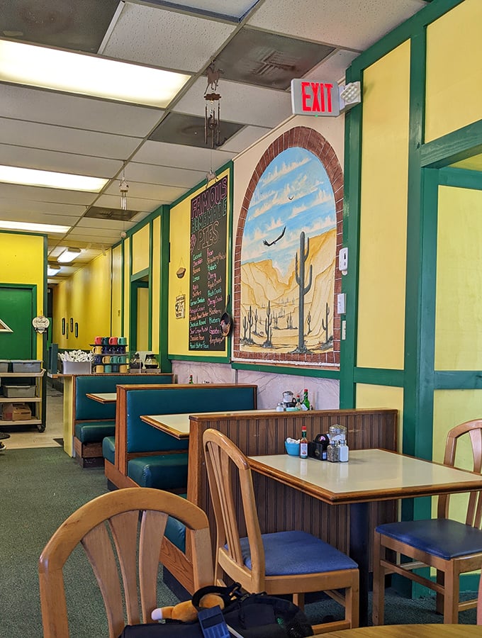 The western-themed interior with its painted desert scenes and comfortable booths proves that sometimes the best dining rooms are the ones that transport you elsewhere.