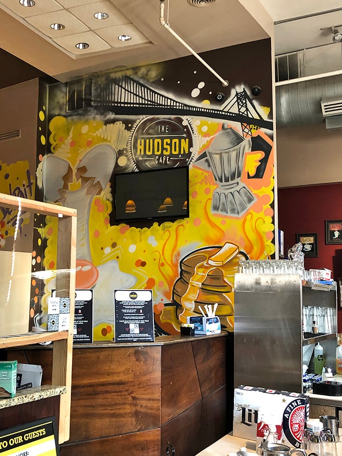 Detroit's Ambassador Bridge mural watches over diners—a reminder that this cafe bridges the gap between ordinary breakfast and morning masterpieces.