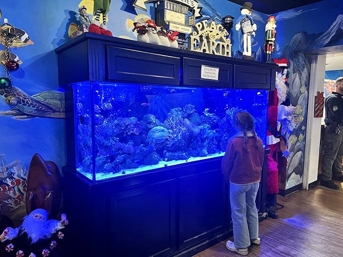 The massive aquarium isn't just decoration—it's dinner and a show. Kids mesmerized by colorful fish while parents enjoy the fruits of the sea. Circle of life, deliciously illustrated.