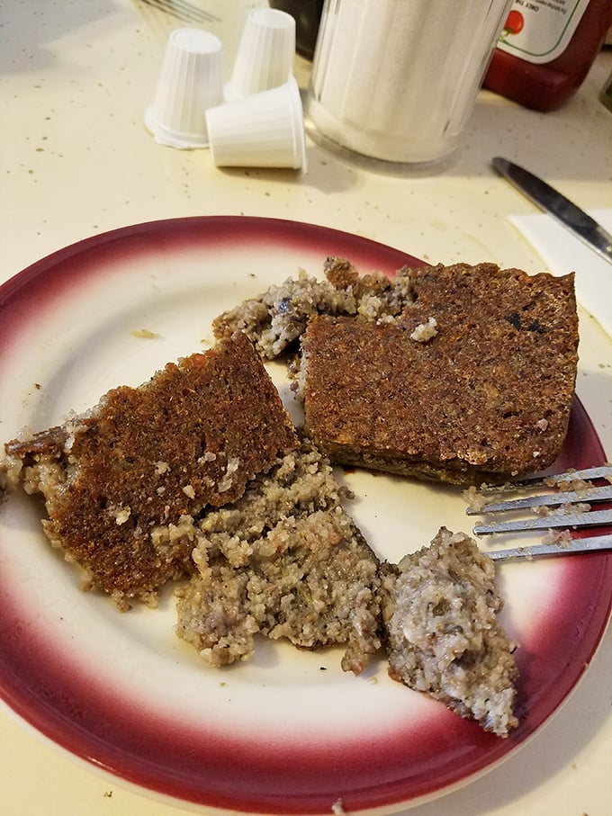 Meatloaf on a diner plate isn't just food—it's a time machine that transports you straight to grandma's kitchen.