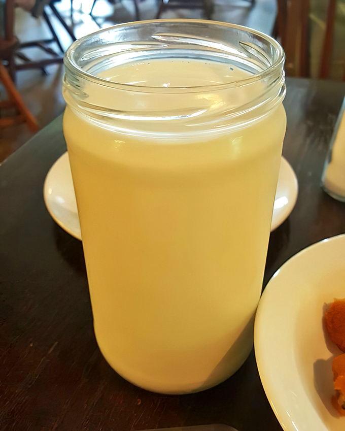 Sweet tea served in a mason jar—because in Tennessee, drinking this golden elixir from anything else would be considered sacrilege.