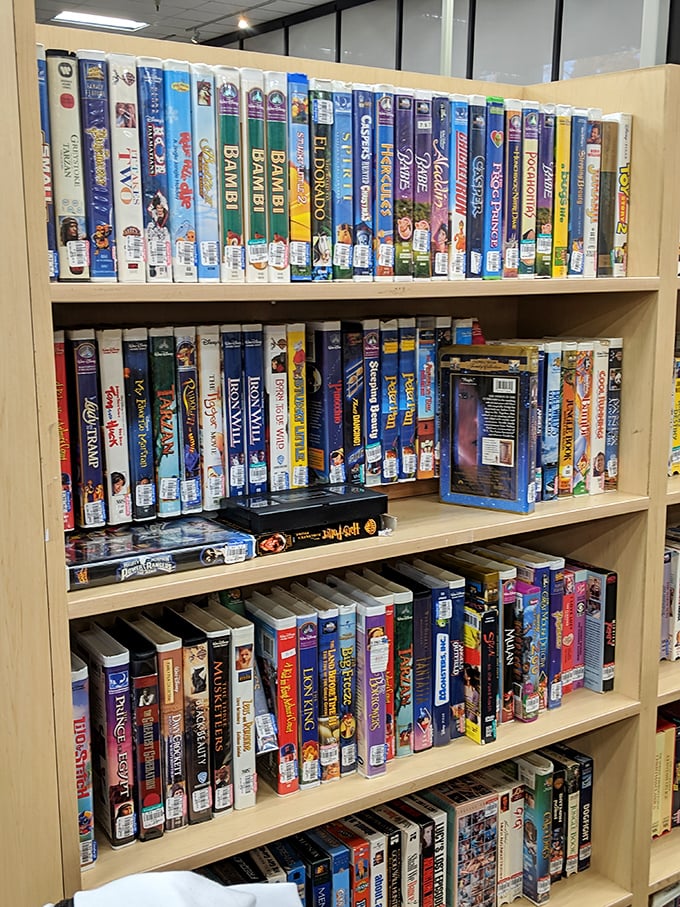 The media section—where VHS tapes and DVDs create a nostalgic timeline of entertainment history. Disney classics never go out of style!