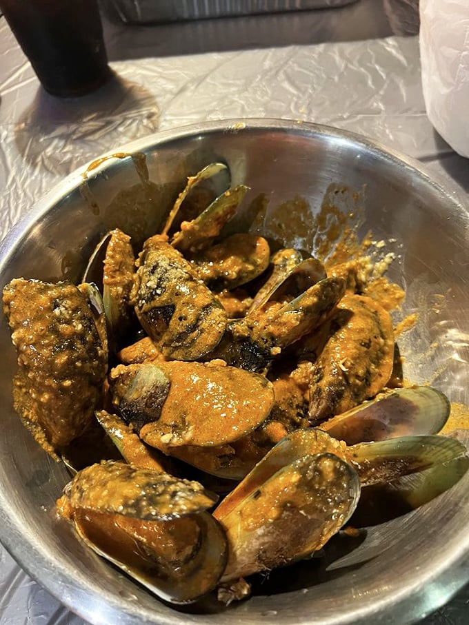 Mussels bathed in Cajun spices, opening up to reveal their secrets. These aren't just shellfish—they're little oceanic treasure chests of flavor.