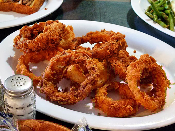 Onion rings with the perfect crunch-to-give ratio—the kind that make you wonder why anyone bothers with those sad fast-food versions.