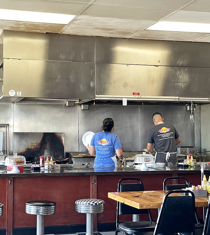 Cooks working their magic behind the counter—the unsung heroes turning simple ingredients into memorable meals.
