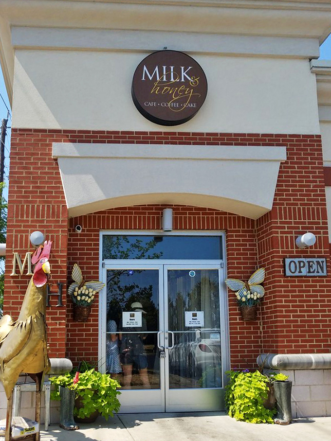 The circular Milk & Honey sign flanked by whimsical metal roosters—a promise of farmhouse flavors without the actual farm work.