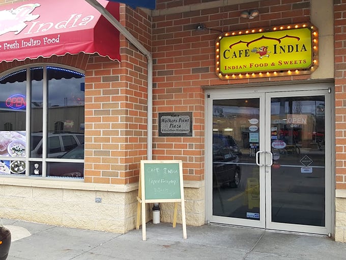 A humble sidewalk sign and illuminated storefront—the culinary equivalent of "don't judge a book by its cover."