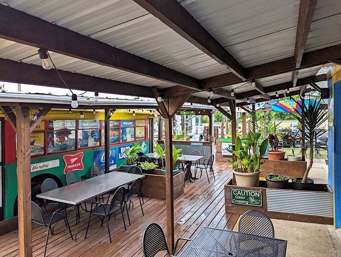 The outdoor dining area offers a tropical oasis in the heart of Kent. Those plants aren't just decoration – they're vacation vibes without the airfare.