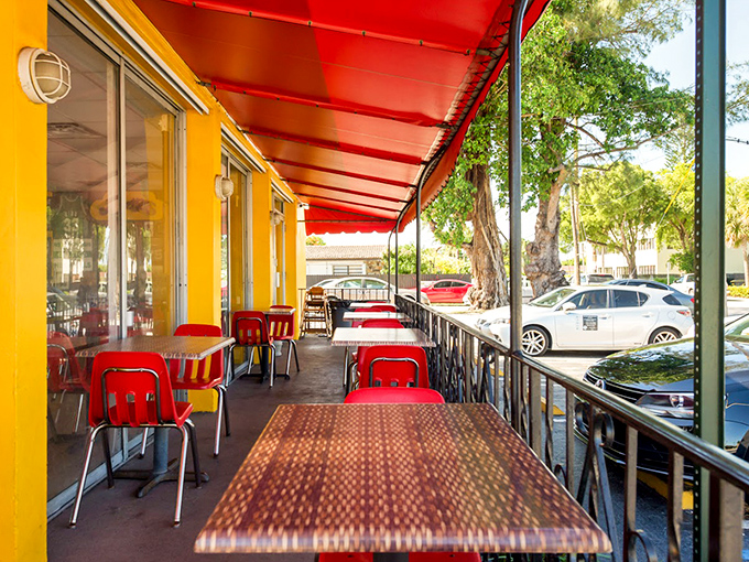 Outdoor seating under that cheerful awning lets you enjoy your meal while soaking up Miami sunshine – eating well in the fresh air never disappoints.