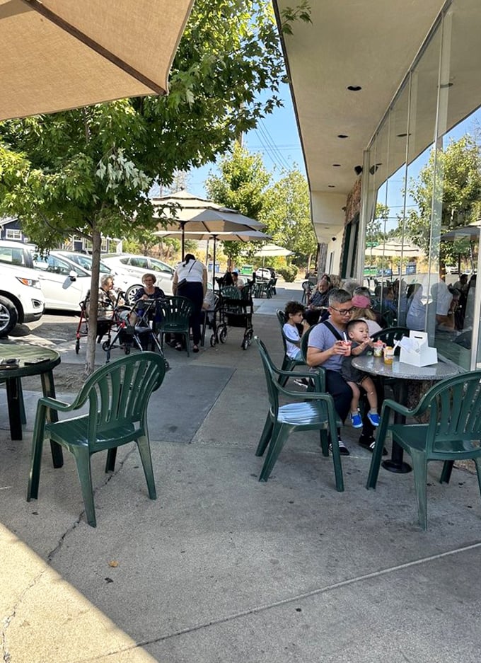 The outdoor patio: where strangers become friends united by the universal language of "brain freeze" and chocolate-stained napkins.