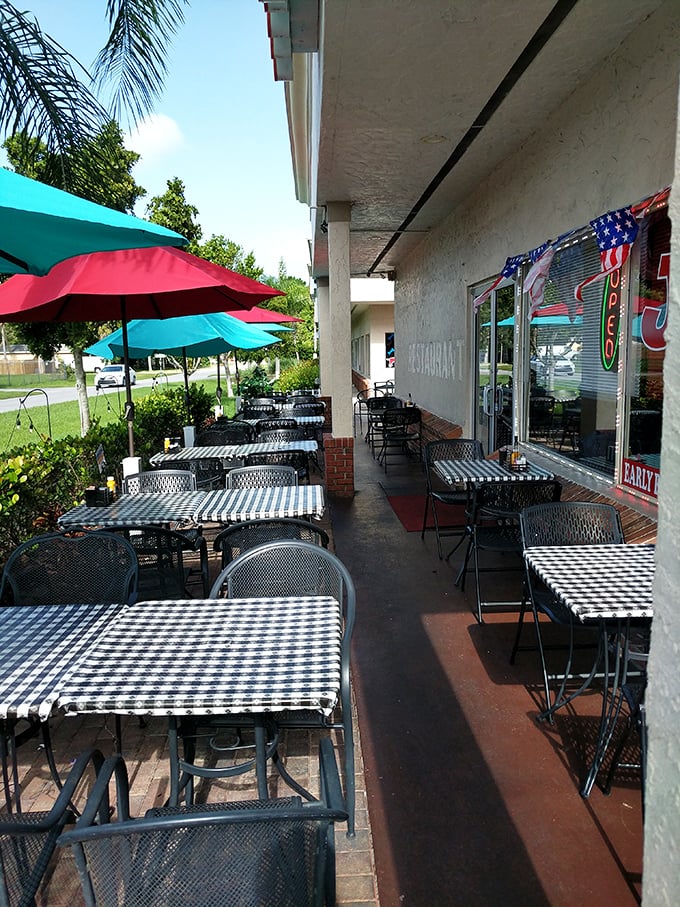 Florida dining done right—outdoor tables under the shade where the morning breeze carries conversations and coffee steam in equal measure.