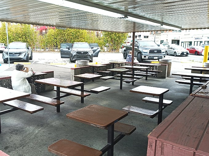 The outdoor seating area—simple, functional, perfect. When the food is this good, white tablecloths would just get in the way.