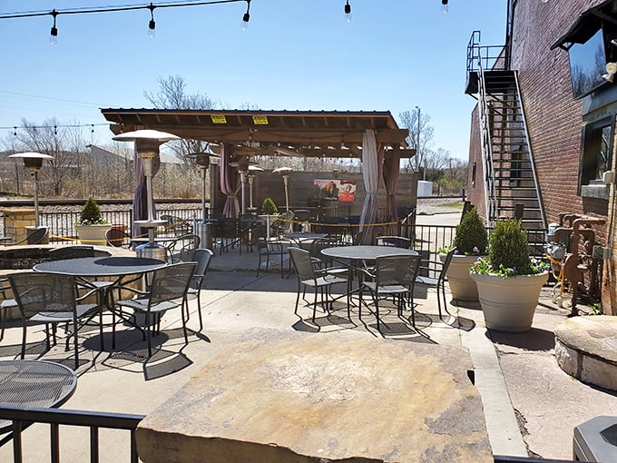 The outdoor patio offers al fresco dining with Midwestern practicality—string lights, shade, and space to loosen your belt after that 25-ounce porterhouse.