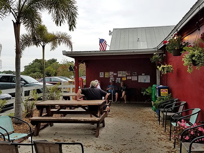 The outdoor waiting area—where strangers become temporary friends united by the universal language of hunger and anticipation.
