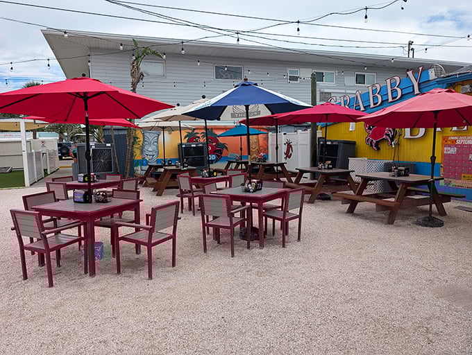 Outdoor seating that captures the essence of coastal dining—colorful umbrellas, picnic tables, and the promise of fresh air with fresher seafood.
