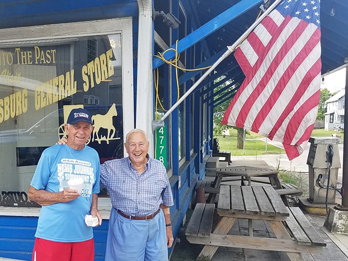 Two generations sharing ice cream outside a historic general store – this is Norman Rockwell territory, alive and thriving.