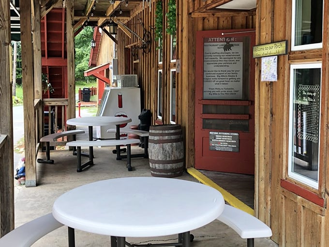 Outdoor seating with rustic barrel tables offers a chance to enjoy your feast while soaking in the mountain air.