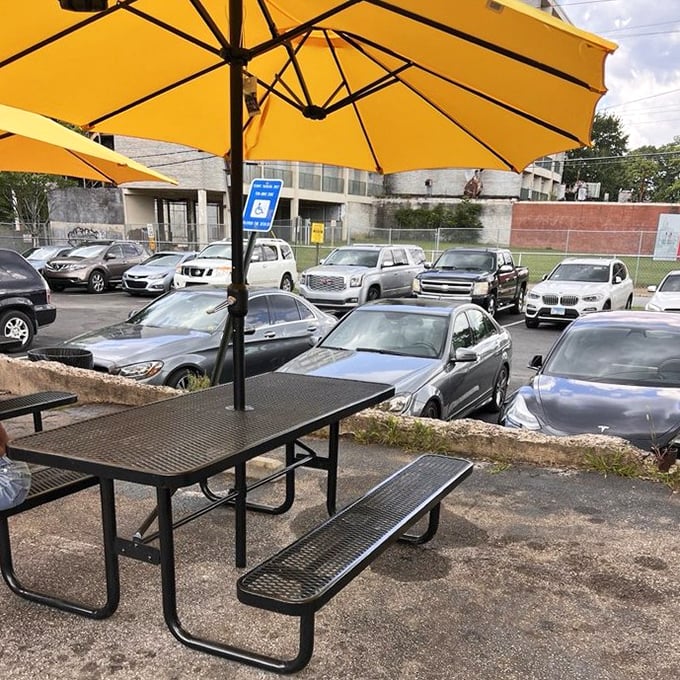 Even the parking lot has character—a mix of luxury cars and work trucks united by the pursuit of perfect fried chicken.