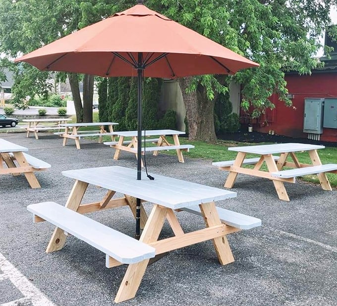 Outdoor picnic tables under shade trees offer a perfect summer setting for getting properly messy with your rack of ribs.