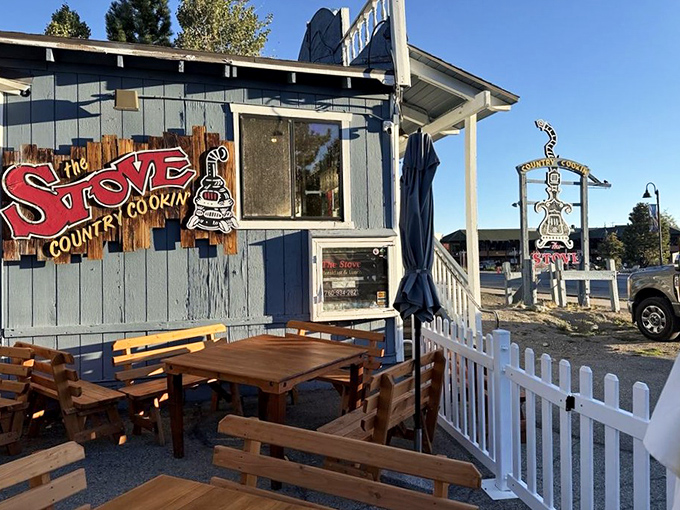 The outdoor seating area offers mountain air with your meal—because sometimes the only thing better than comfort food is comfort food with a view.