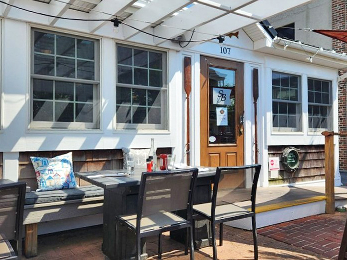 The outdoor seating area—where fresh air enhances fresh seafood. Those Adirondack chairs aren't just comfortable—they're strategic digestion stations.