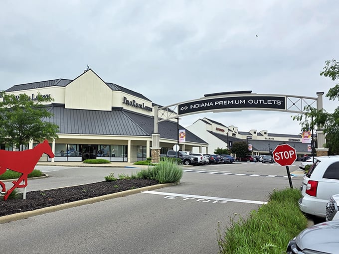 The red arrow points the way to savings, while the entrance arch welcomes you to what many consider their retail happy place.