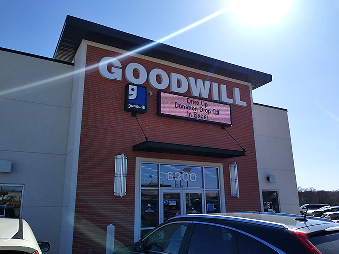 Sunshine bounces off the Goodwill sign, nature's spotlight on one of Lincoln's most wallet-friendly shopping destinations.