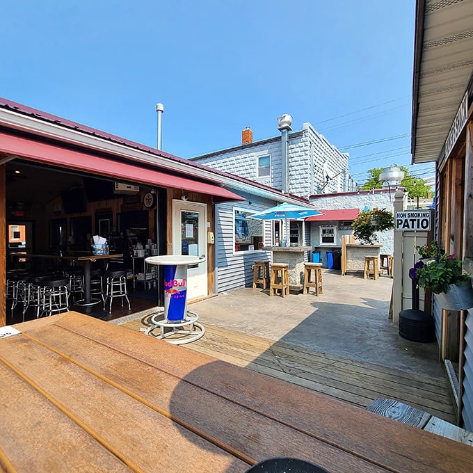 Summer afternoons were made for patios like this. That open garage door isn't just for ventilation—it's an invitation to linger longer.