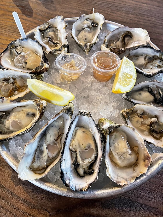 Oysters arranged in a perfect circle like Neptune's own poker game—briny treasures waiting to slide down your throat with a squeeze of lemon.