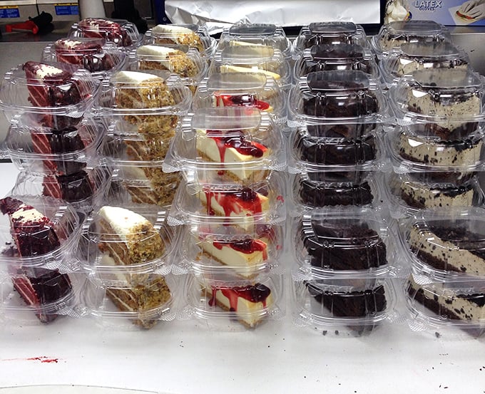 Sweet temptations lined up like soldiers—cheesecake, chocolate cake, and other treats standing by for dessert duty.