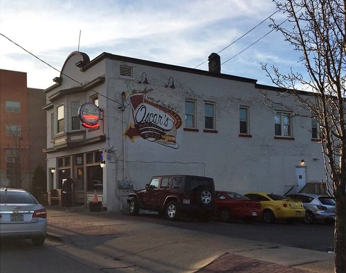 A mural on the building's side celebrates Oscar's burger legacy—like the Sistine Chapel of ground beef artistry.