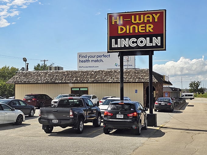 The roadside sign announces the diner's superpower: "EAT 24-7." Three simple words that have saved countless hungry night owls and early birds.