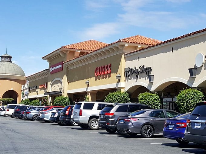 Guess and other luxury brands beckon from their Spanish-style storefronts – retail therapy with architectural flair.